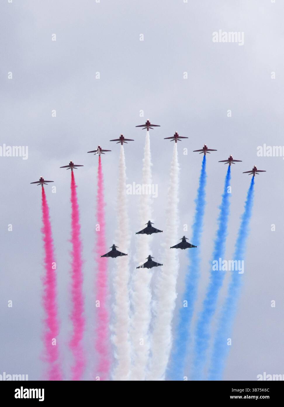 London, UK. 5th May 2025. Red Arrows perform a flypast over The Mall ...