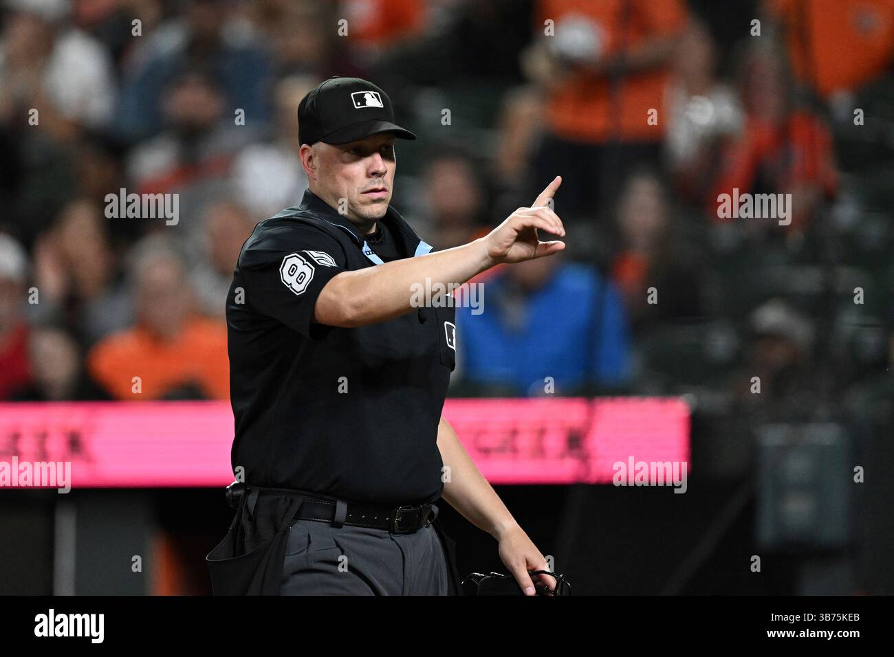 Umpire Stu Scheurwater gestures during a baseball game between the ...
