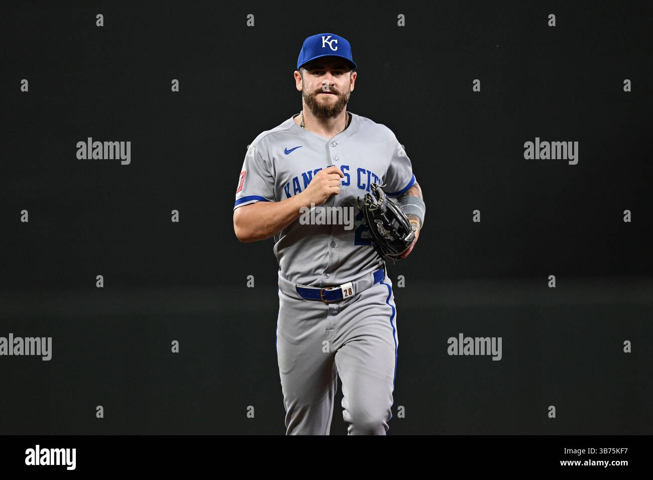 Kansas City Royals outfielder Kyle Isbel jogs off the field during a ...