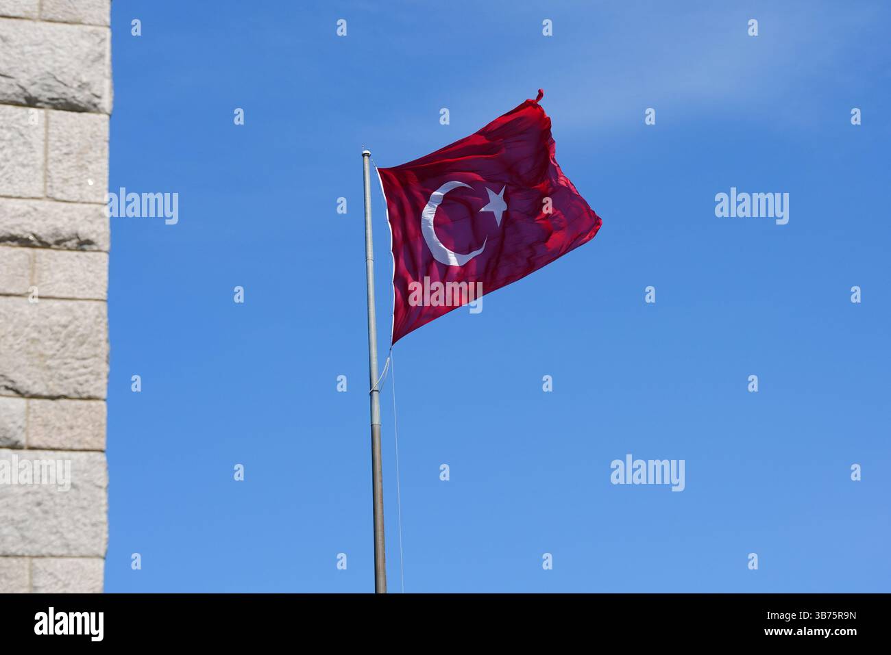 Turkish flag has a white crescent moon and a star on a red background ...