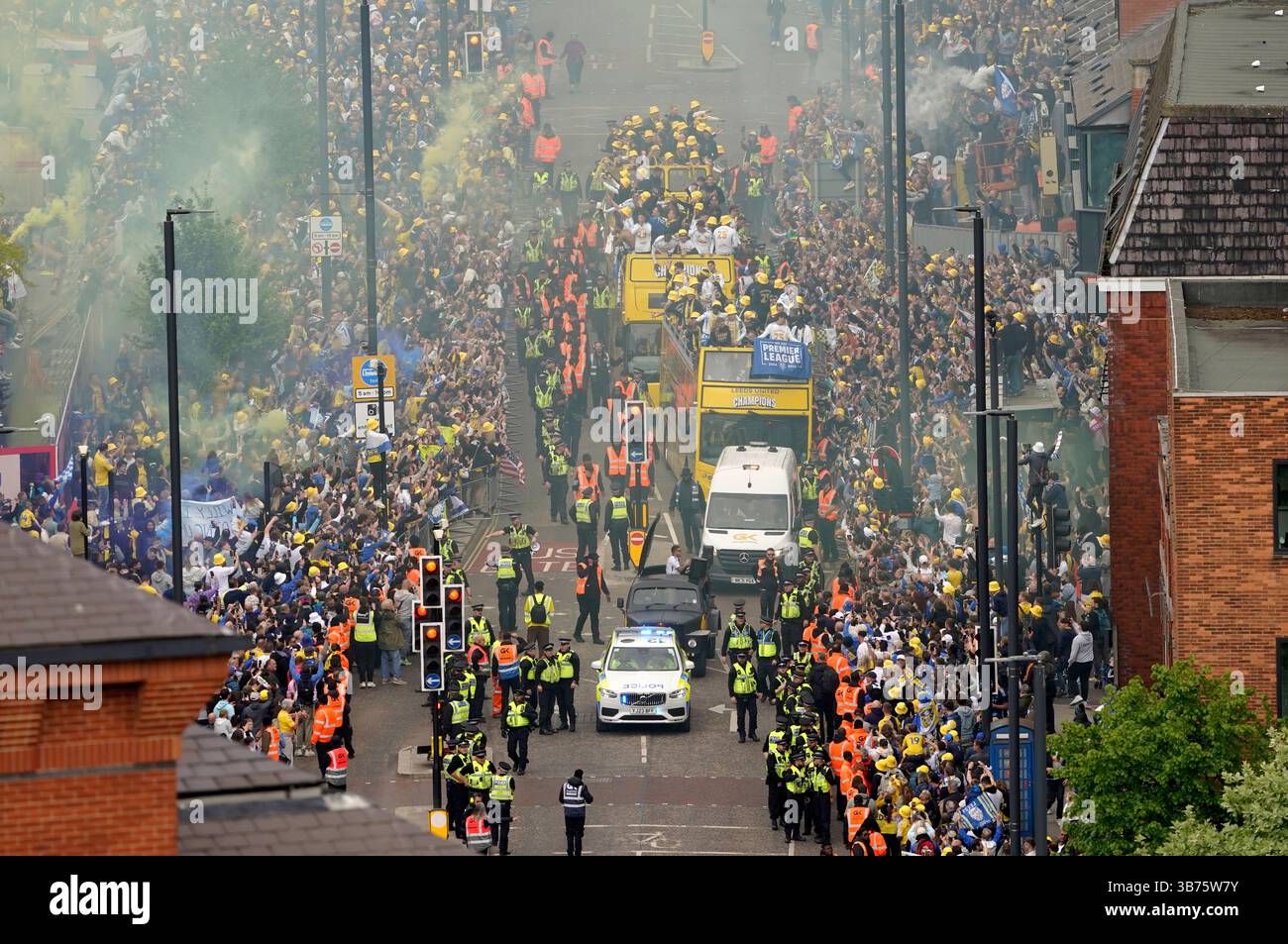 Fans line the street as the Leeds United parade buses enter the city ...