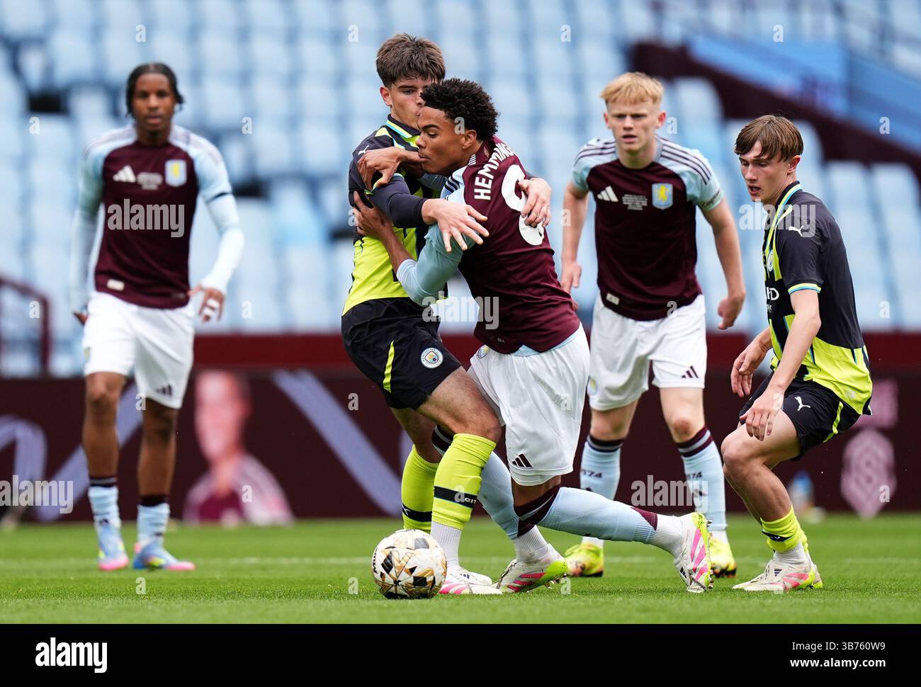 Manchester City's Harrison Miles (left) fouls Aston Villa's George ...