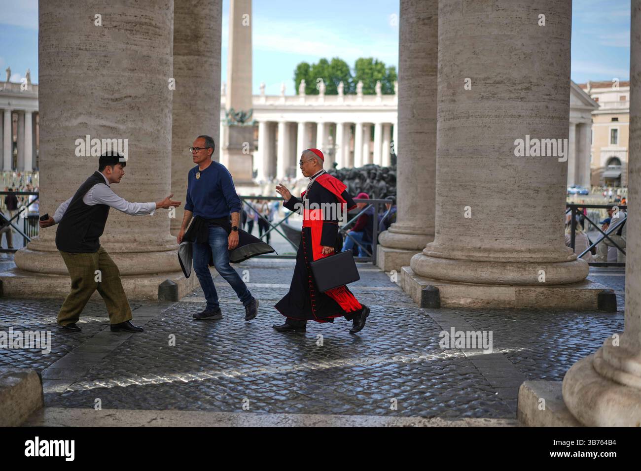 Cardinal William Goh arrives at the Vatican, Monday, May 5, 2025, to ...