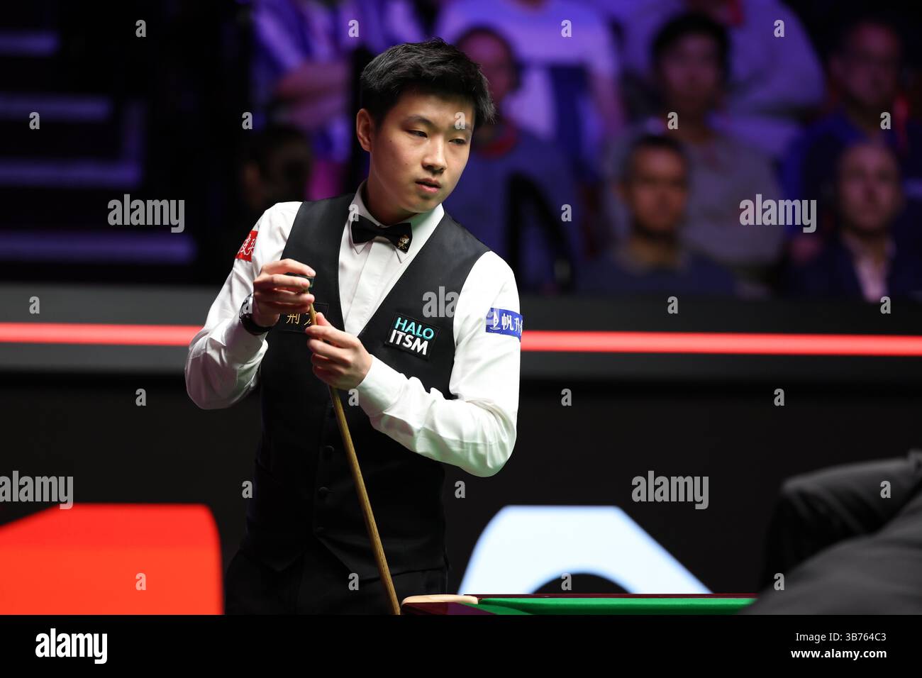 Sheffield, Britain. 5th May, 2025. Zhao Xintong reacts during the final ...