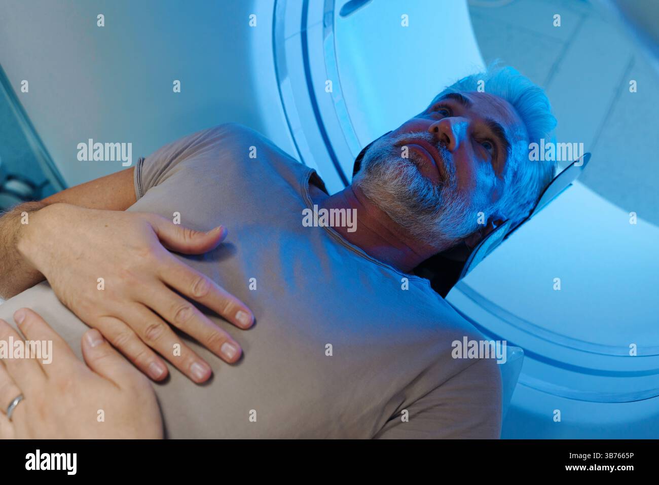 Male patient undergoing CT scan examination in hospital Stock Photo - Alamy
