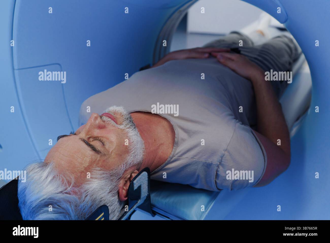 Male patient undergoing CT scan examination in hospital Stock Photo - Alamy