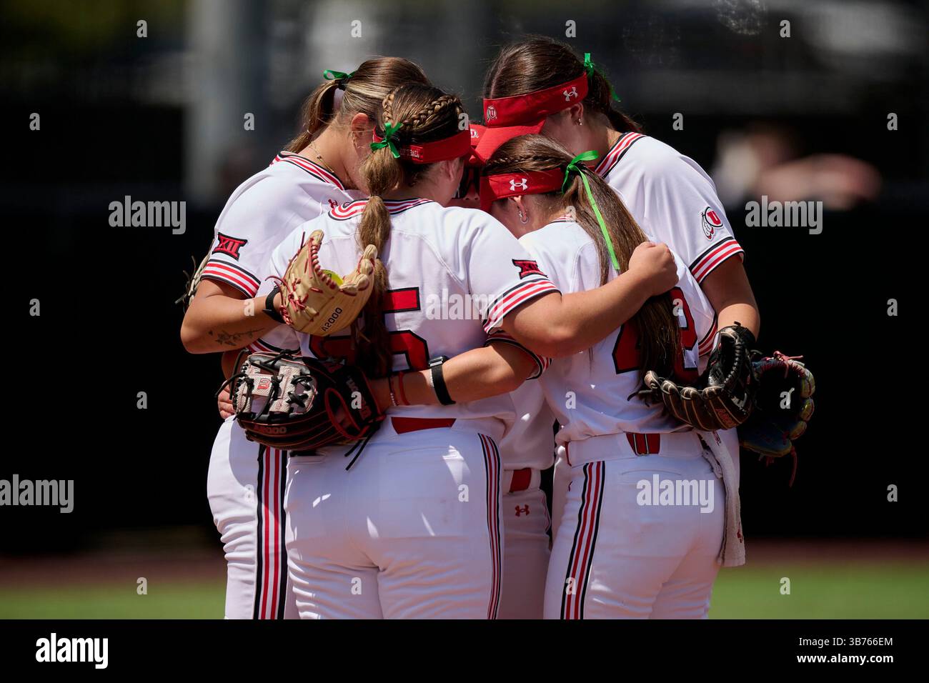 Utah Utes team huddle during an NCAA Softball game against the Oklahoma ...