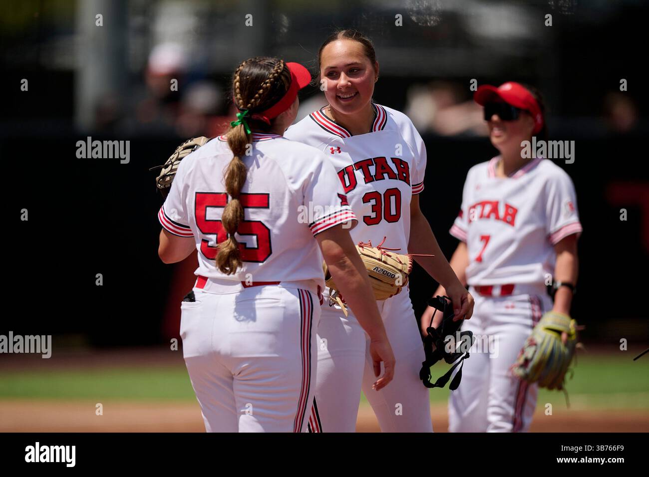 Utah Utes pitcher Hailey Maestretti (30) fist bumps first baseman ...