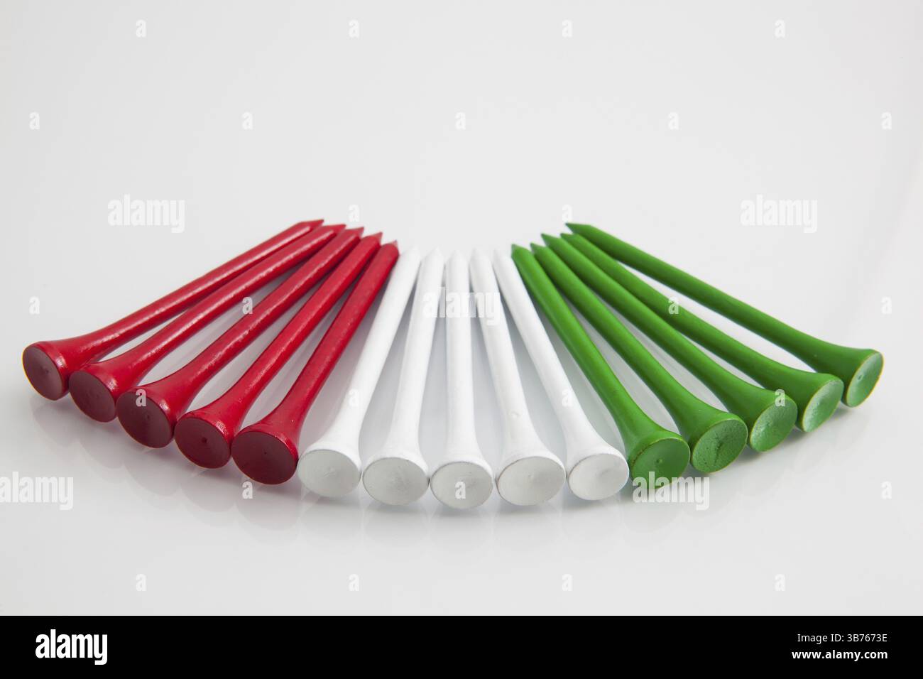 The different colorful wooden golf tees on the white background Stock ...