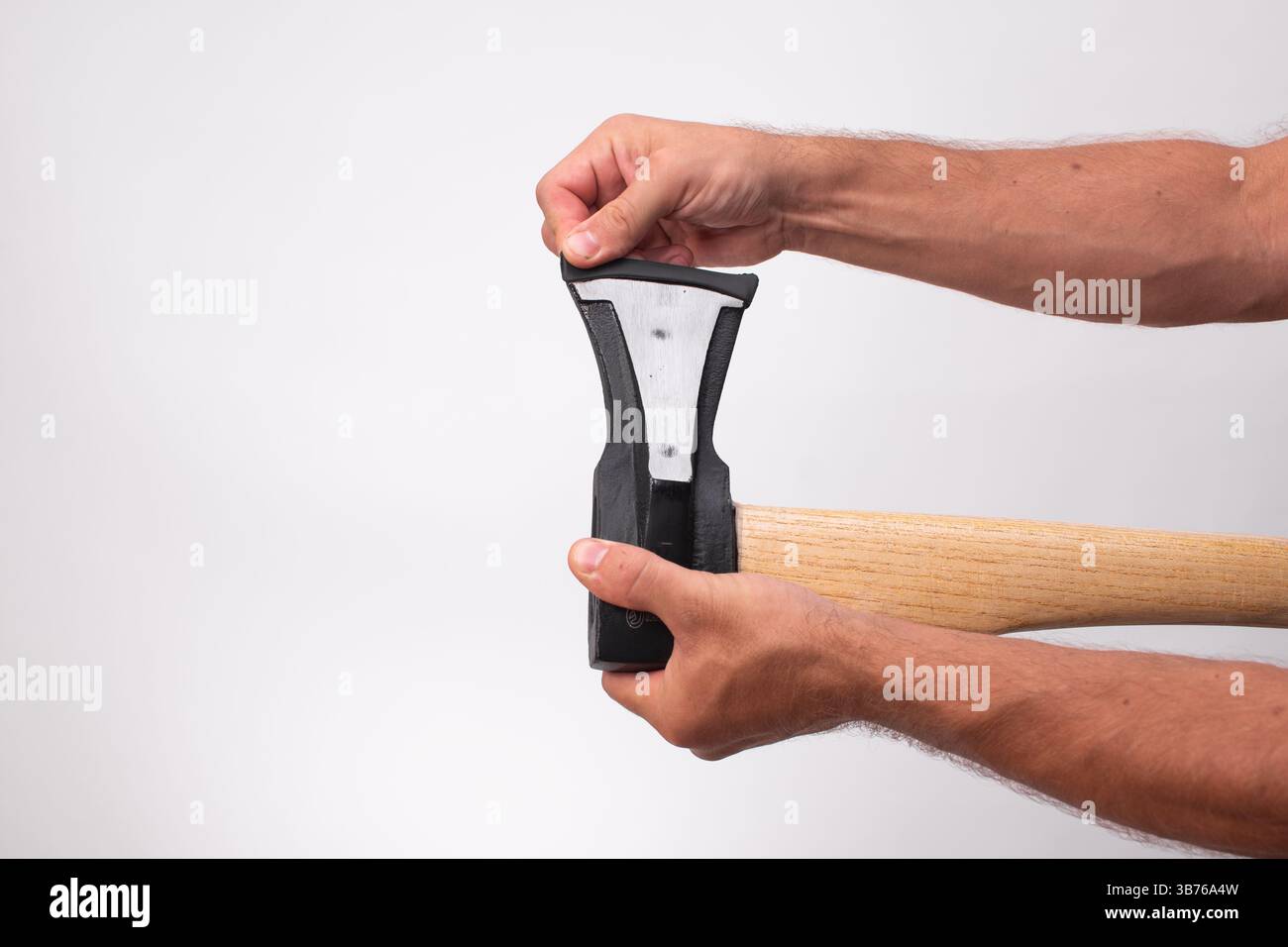men's hands put a protective case on the axe blade Stock Photo - Alamy