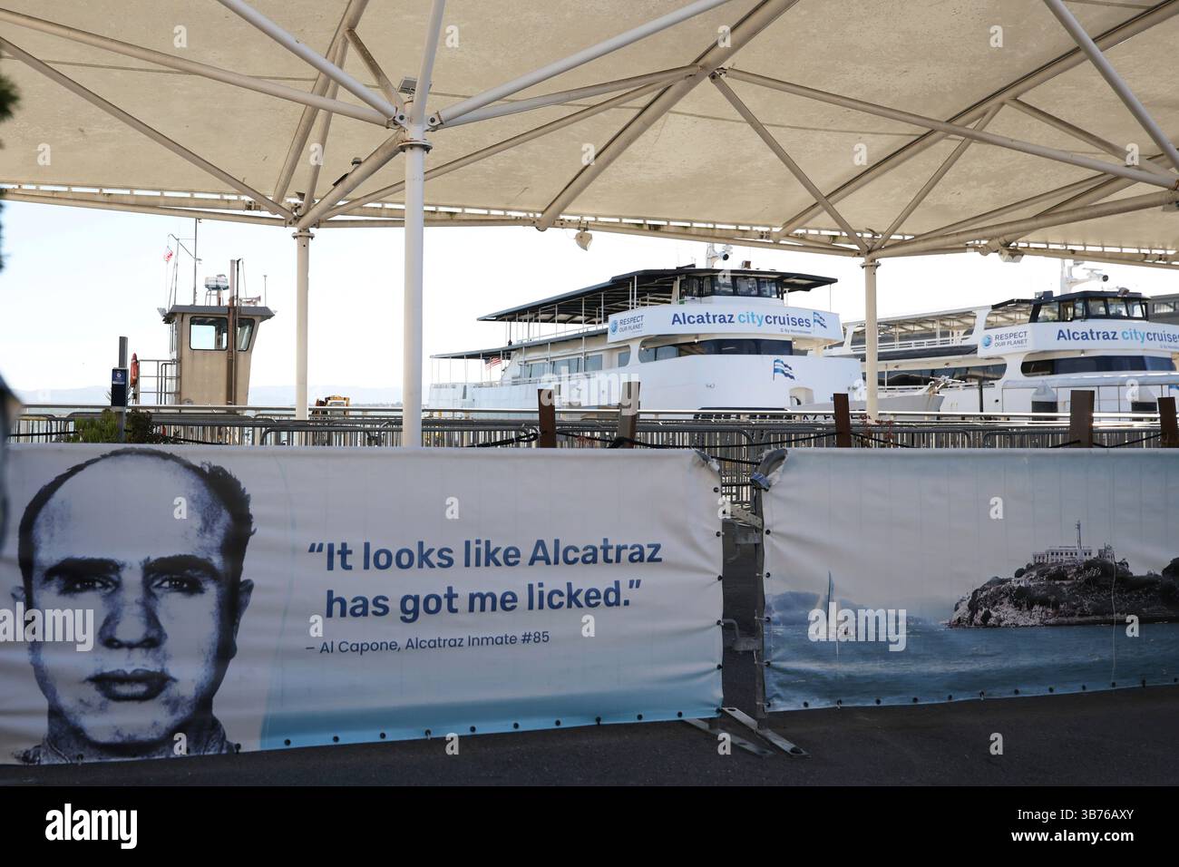 A quote and image of Al Capone are shown on a sign in front of Alcatraz ...