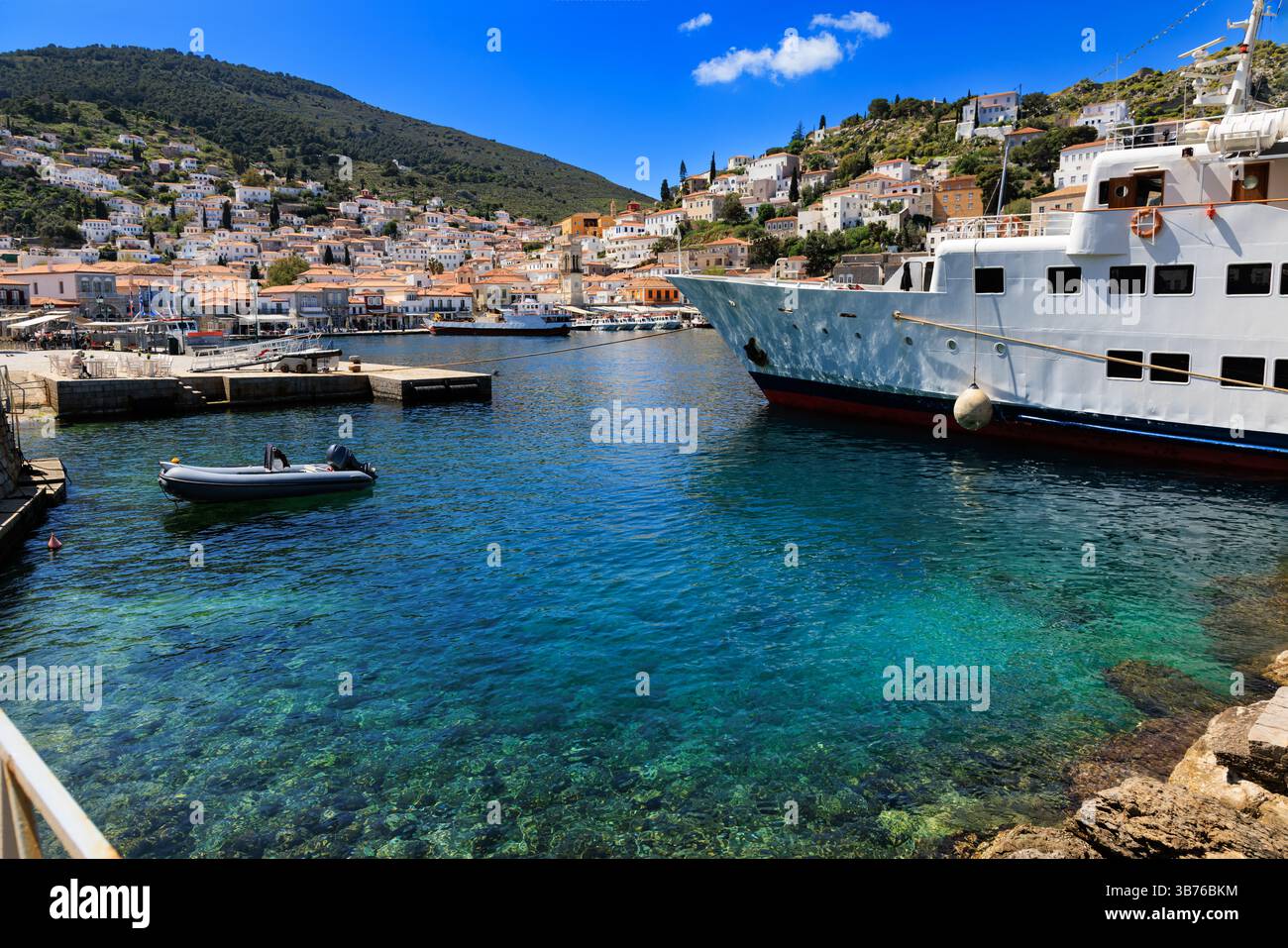Vivid view of Hydra Island harbor, Greece, with turquoise waters ...
