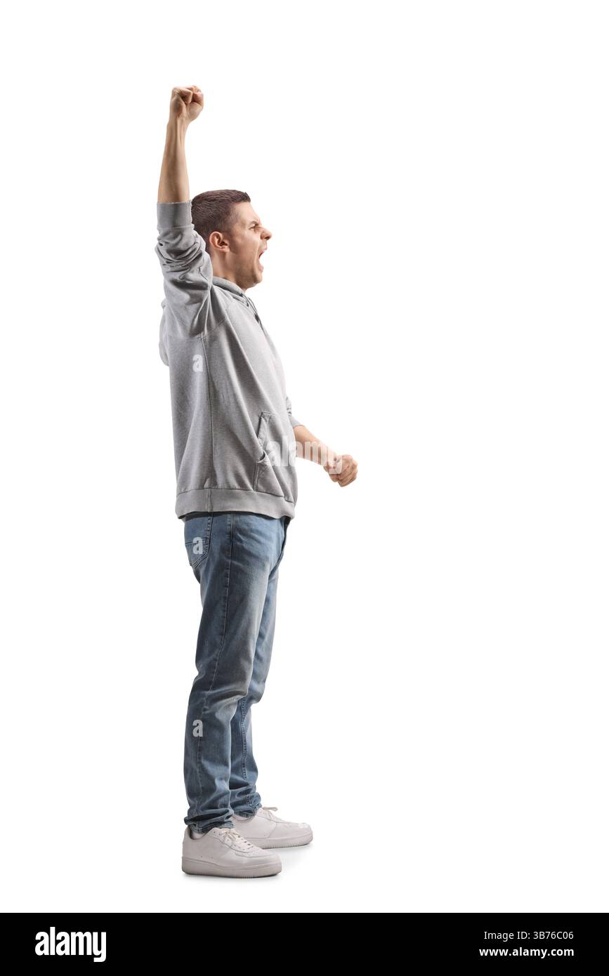 Full length profile shot of a young man cheering and shouting isolated ...