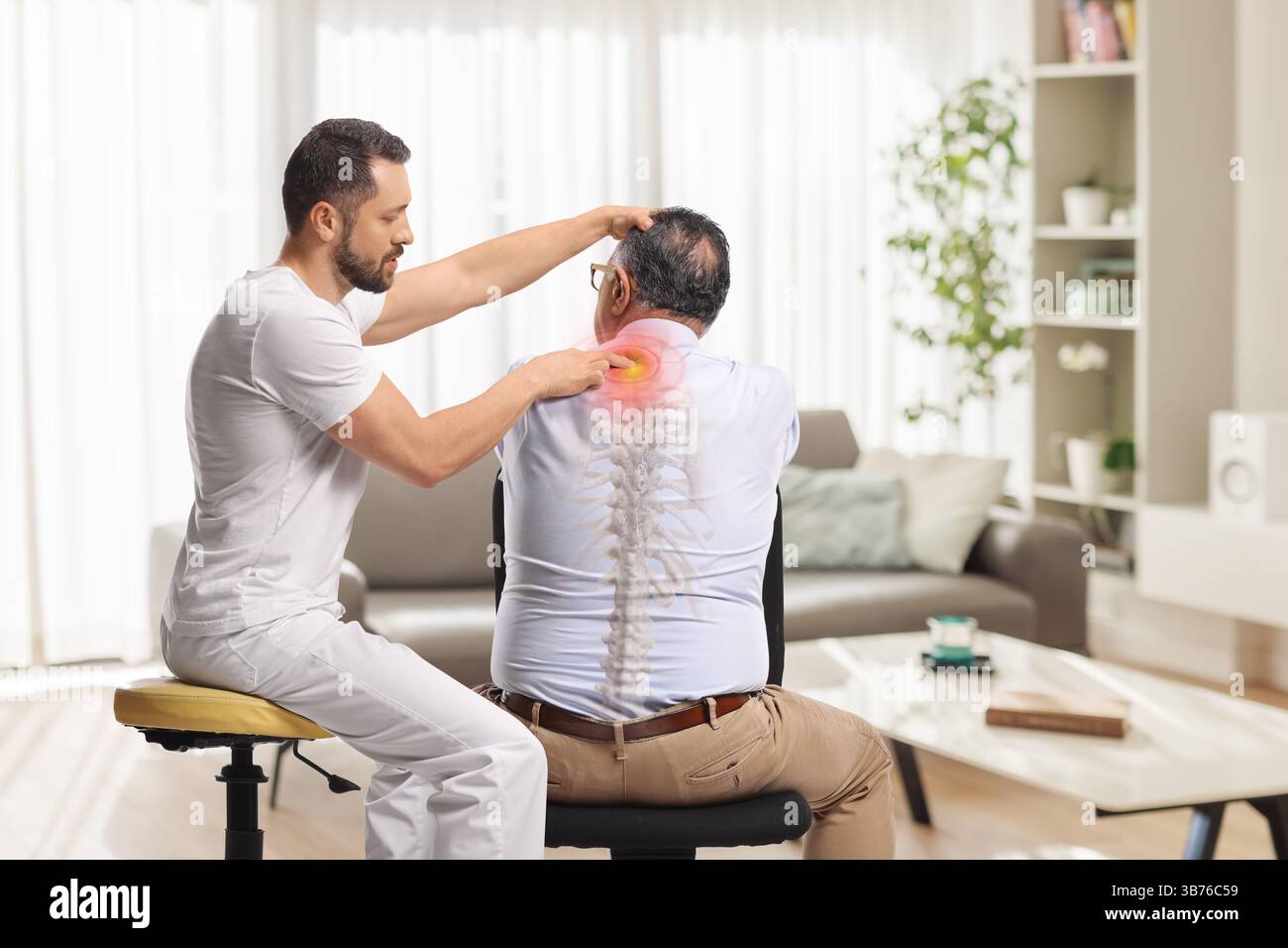 Physical therapist giving a massage to a man Stock Photo - Alamy