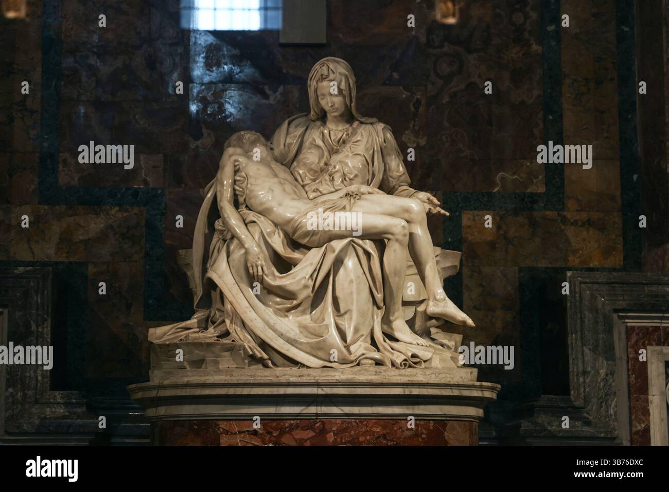 Michelangelo's Pieta in St. Peter's Basilica, Vatican City, depicts the biblical theme of the ...