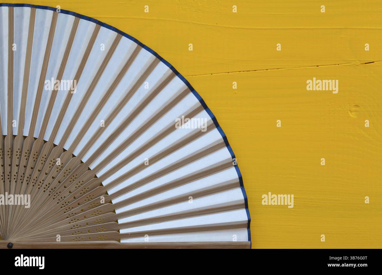 Typical Japanese hand fan made on the wooden yellow table Stock Photo ...