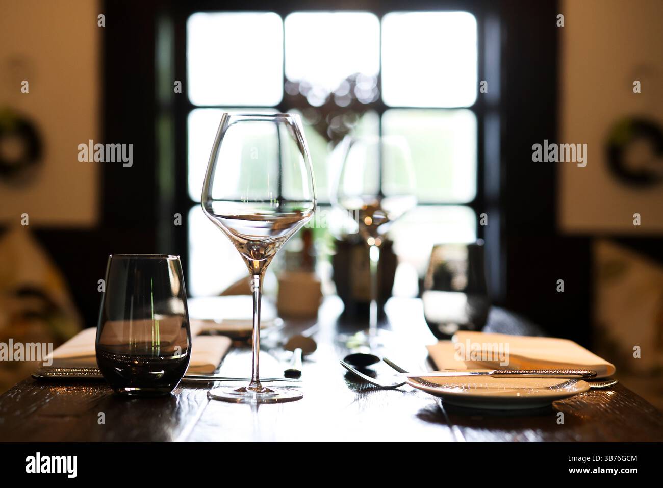 Velbert, Germany. 05th May, 2025. A set table in a restaurant with ...