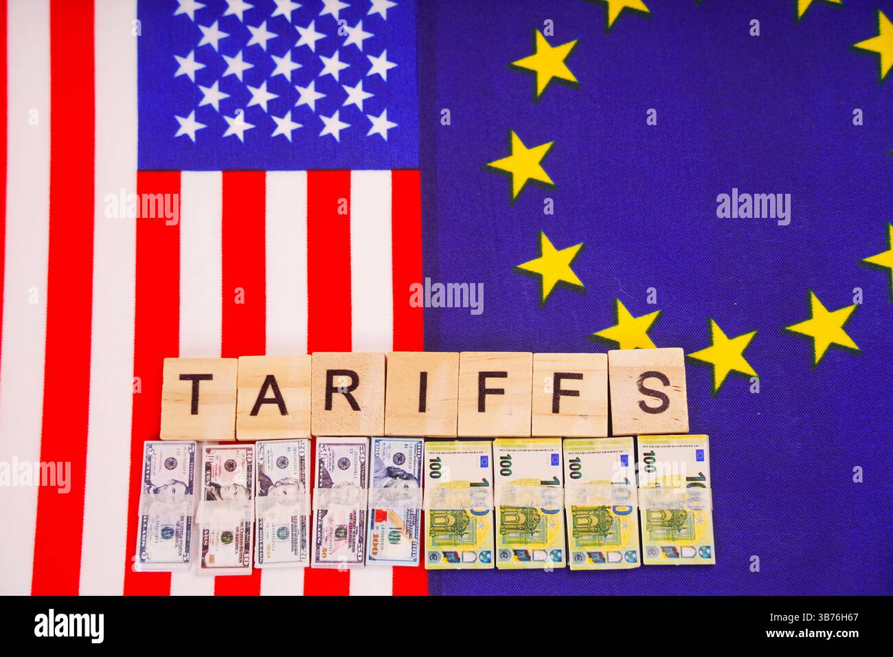 The inscription Tariffs and banknotes on the background of the flags of ...