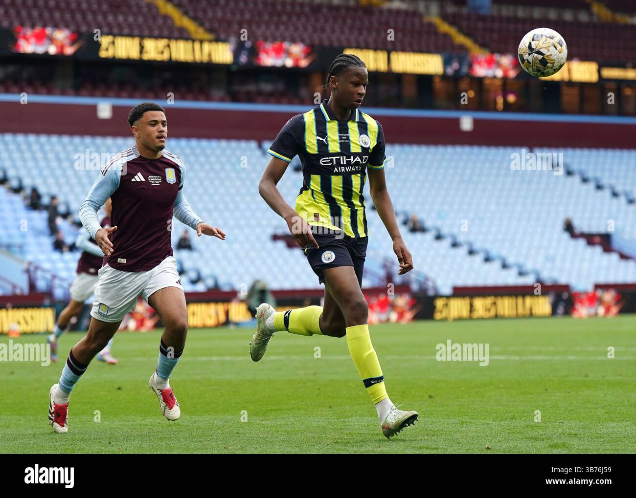 Manchester City's Stephen Mfuni (right) and Aston Villa's Ashton ...