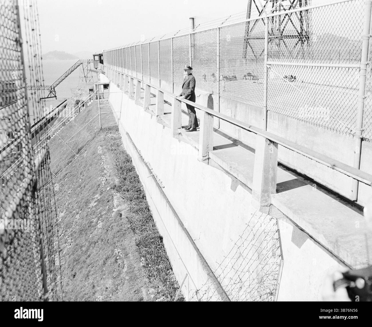FILE - Captain E.E. Rychner of the Alcatraz Federal Penitentiary stands ...