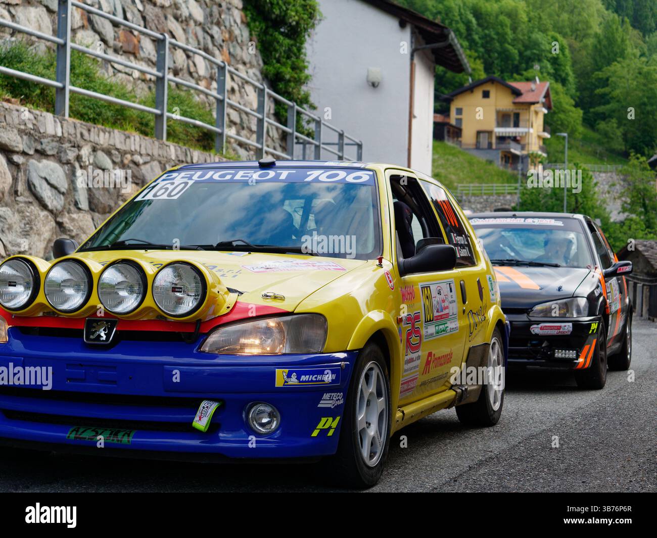 Cars queuing at the start of a Rally Stage near Nus in the Aosta Valley ...