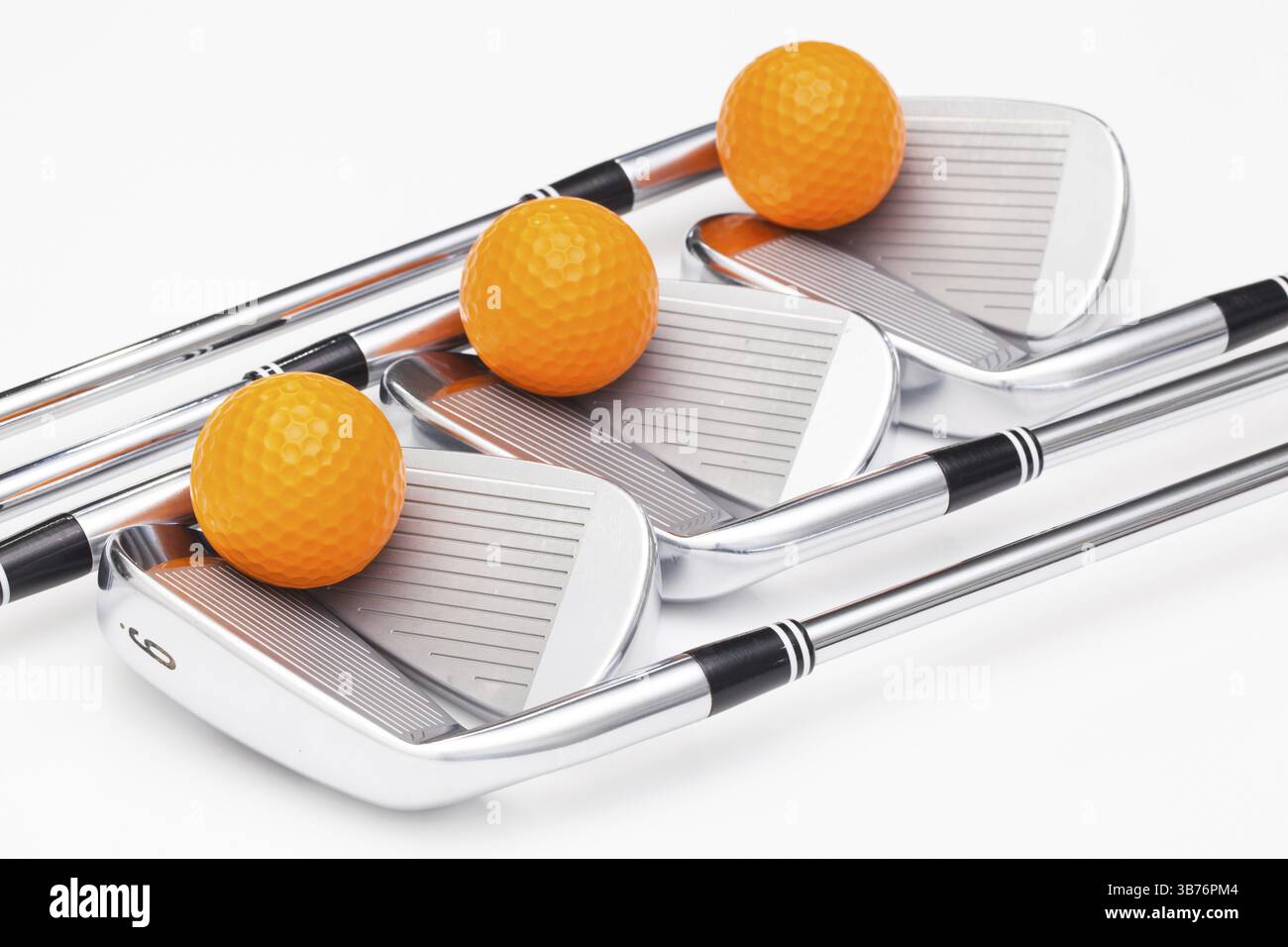 Titanium golf clubs on the white background Stock Photo - Alamy
