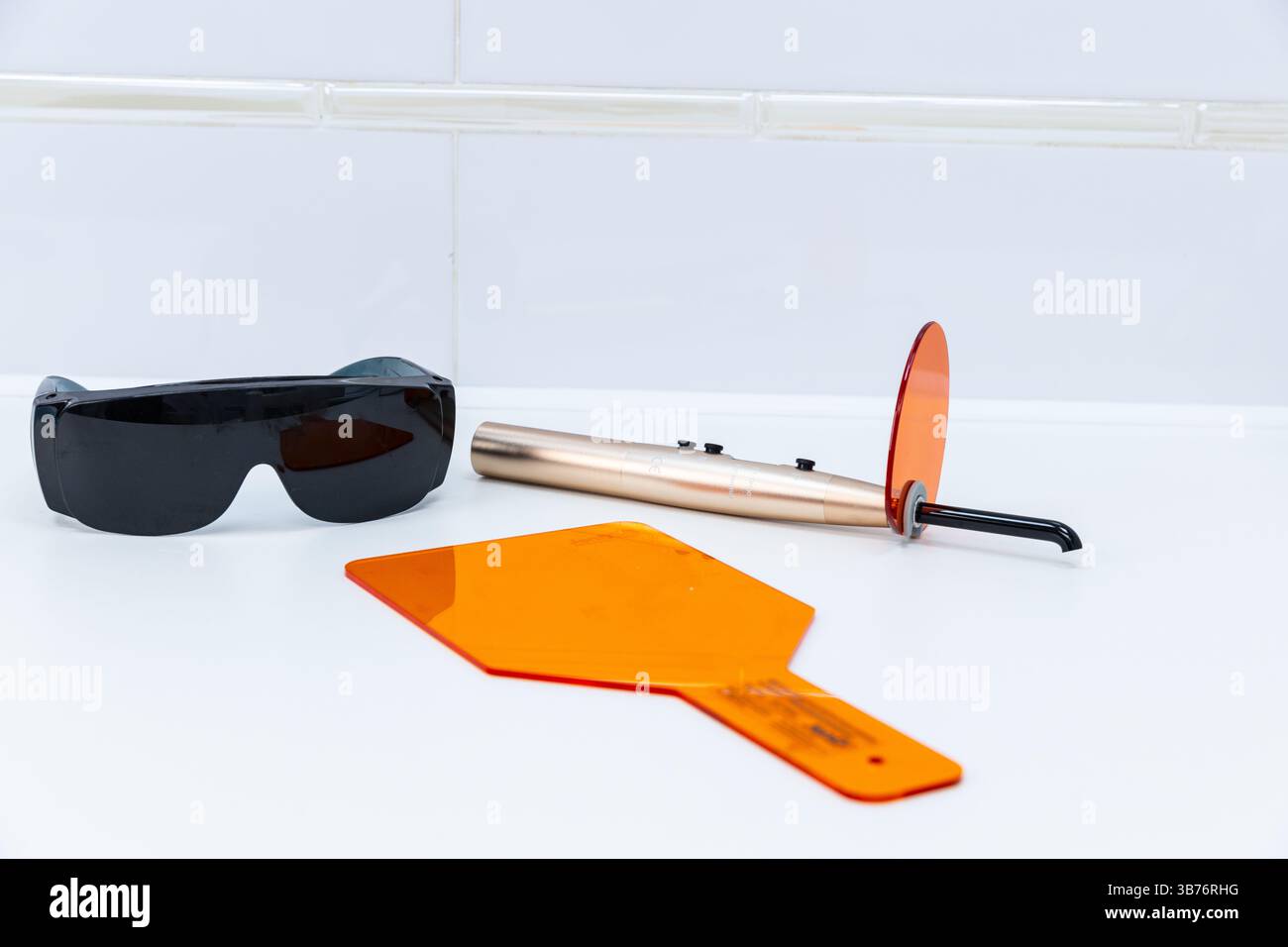 The image presents essential dental tools including black protective ...