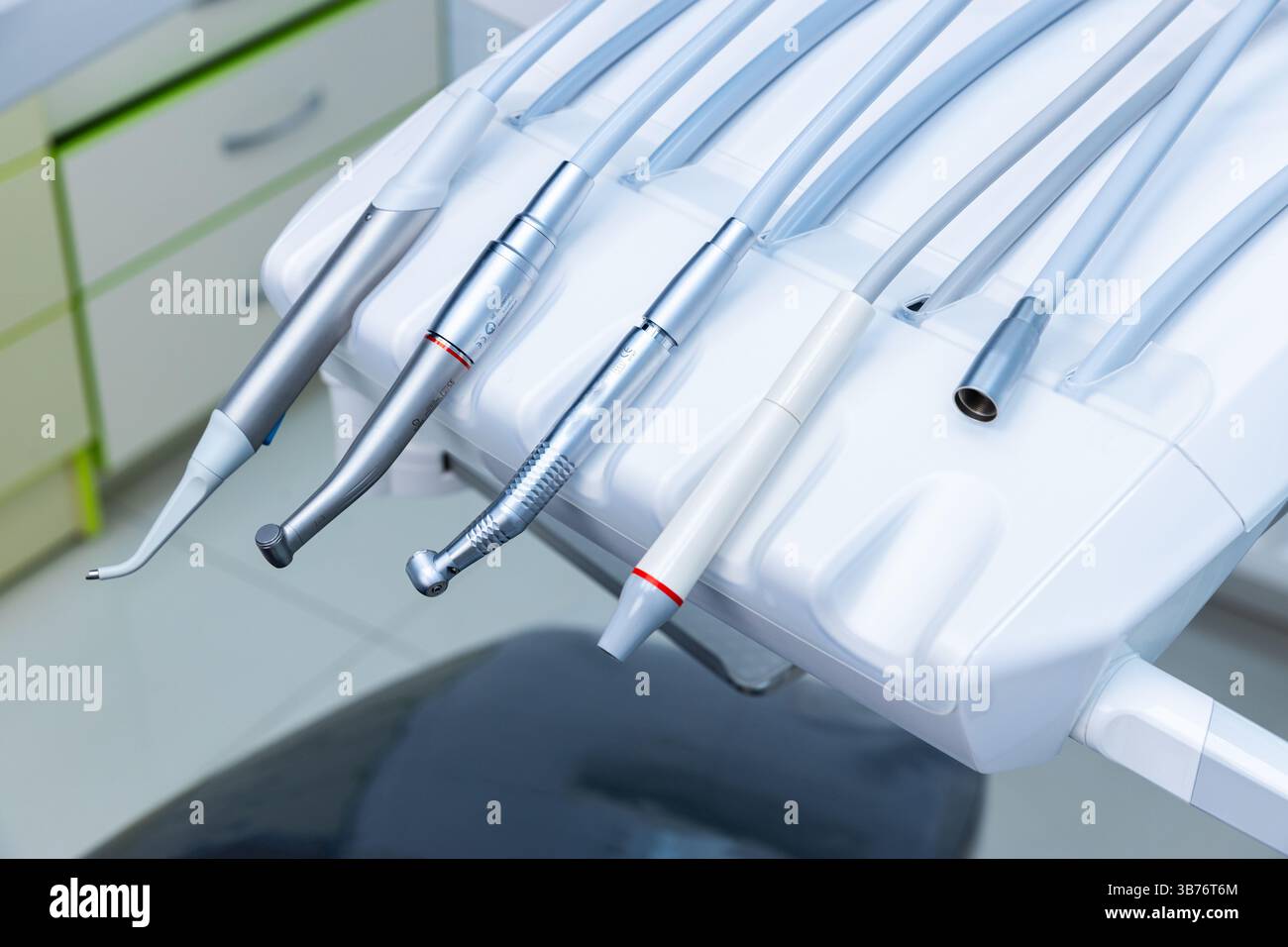 The image displays a range of dental instruments neatly arranged on a ...