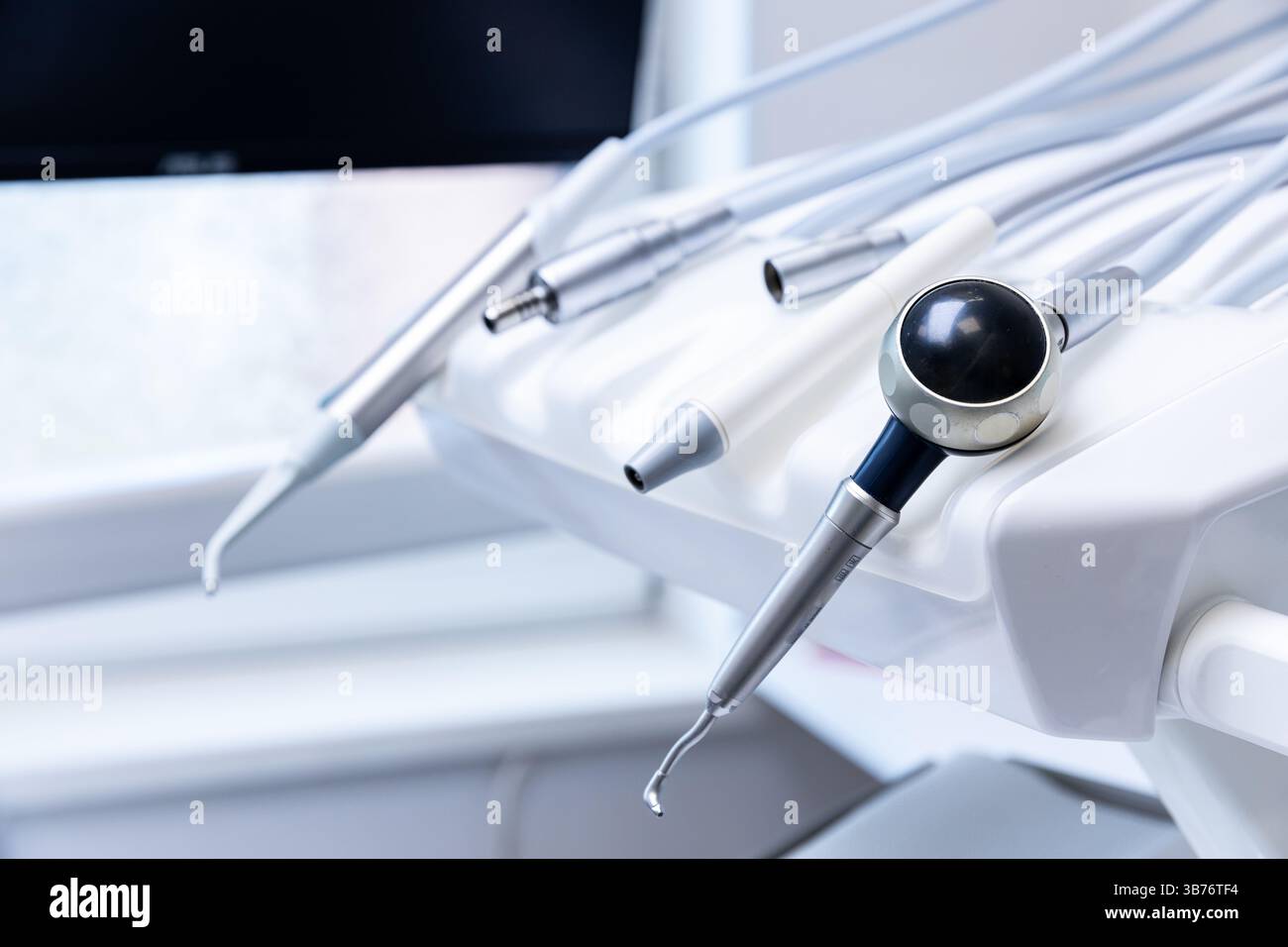 This image showcases various dental tools positioned on a treatment ...