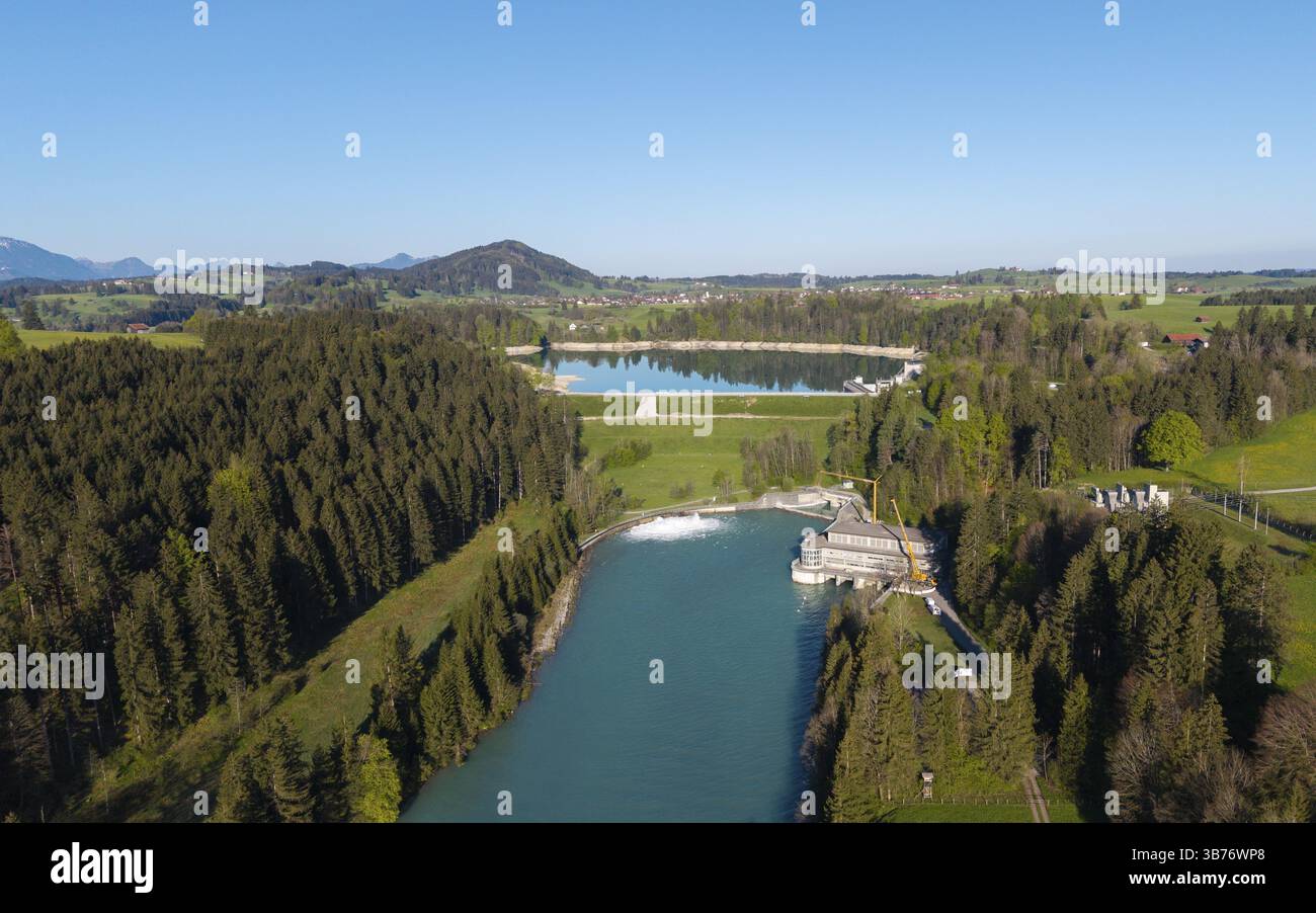 Aerial view of a river flowing through a wooded landscape with a ...