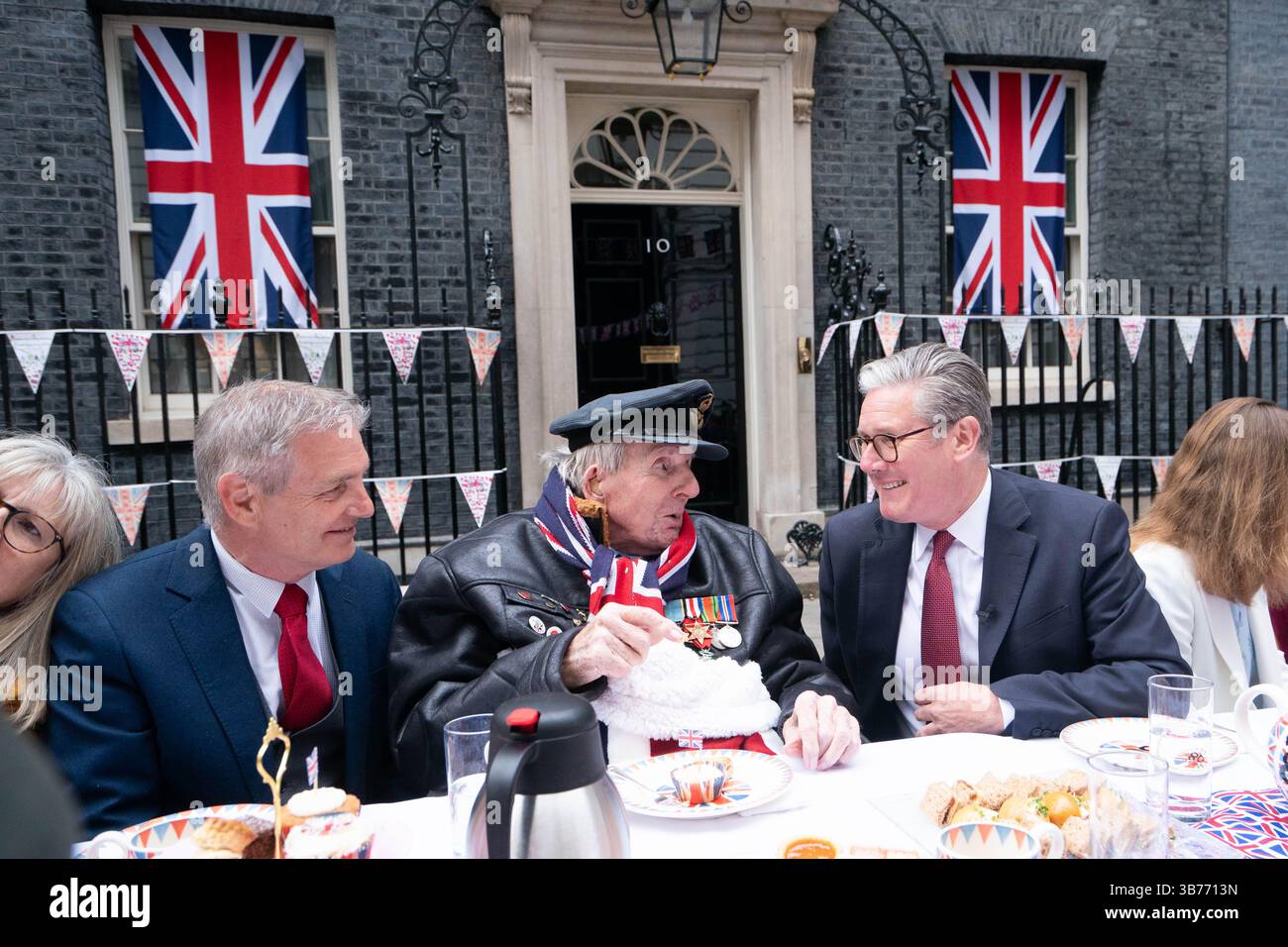 Prime Minister Sir Keir Starmer (right) hosts a VE Day 80th Anniversary street party on Downing ...