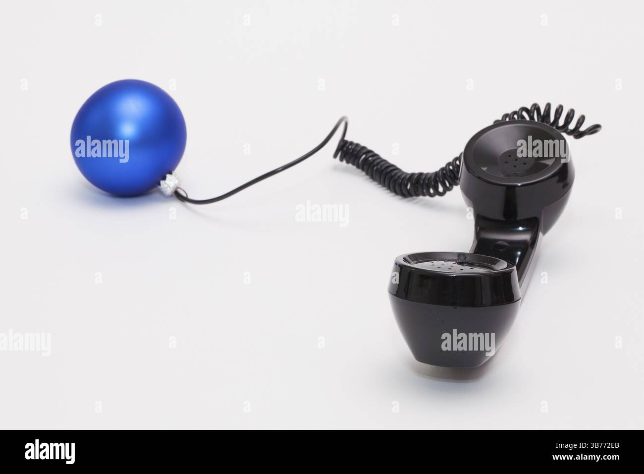 Old phone reciever and cord connection with Christmas decoration ...