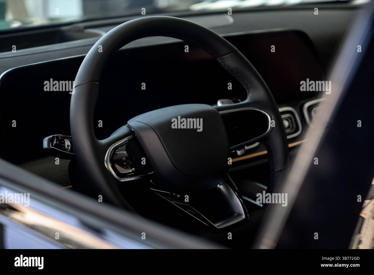Black leather steering wheel, automatic transmission and modern control ...