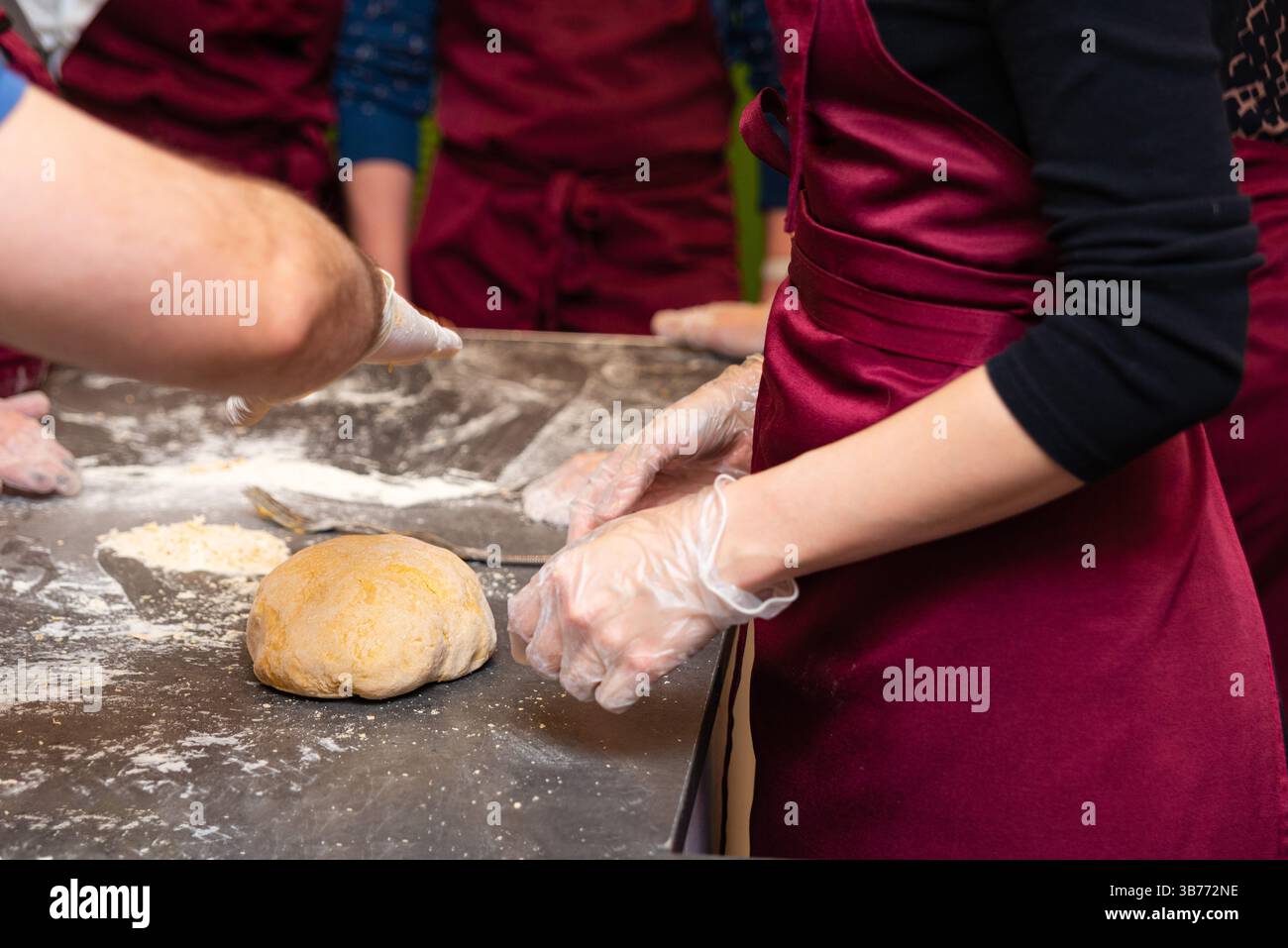 People wearing red aprons hi-res stock photography and images - Alamy