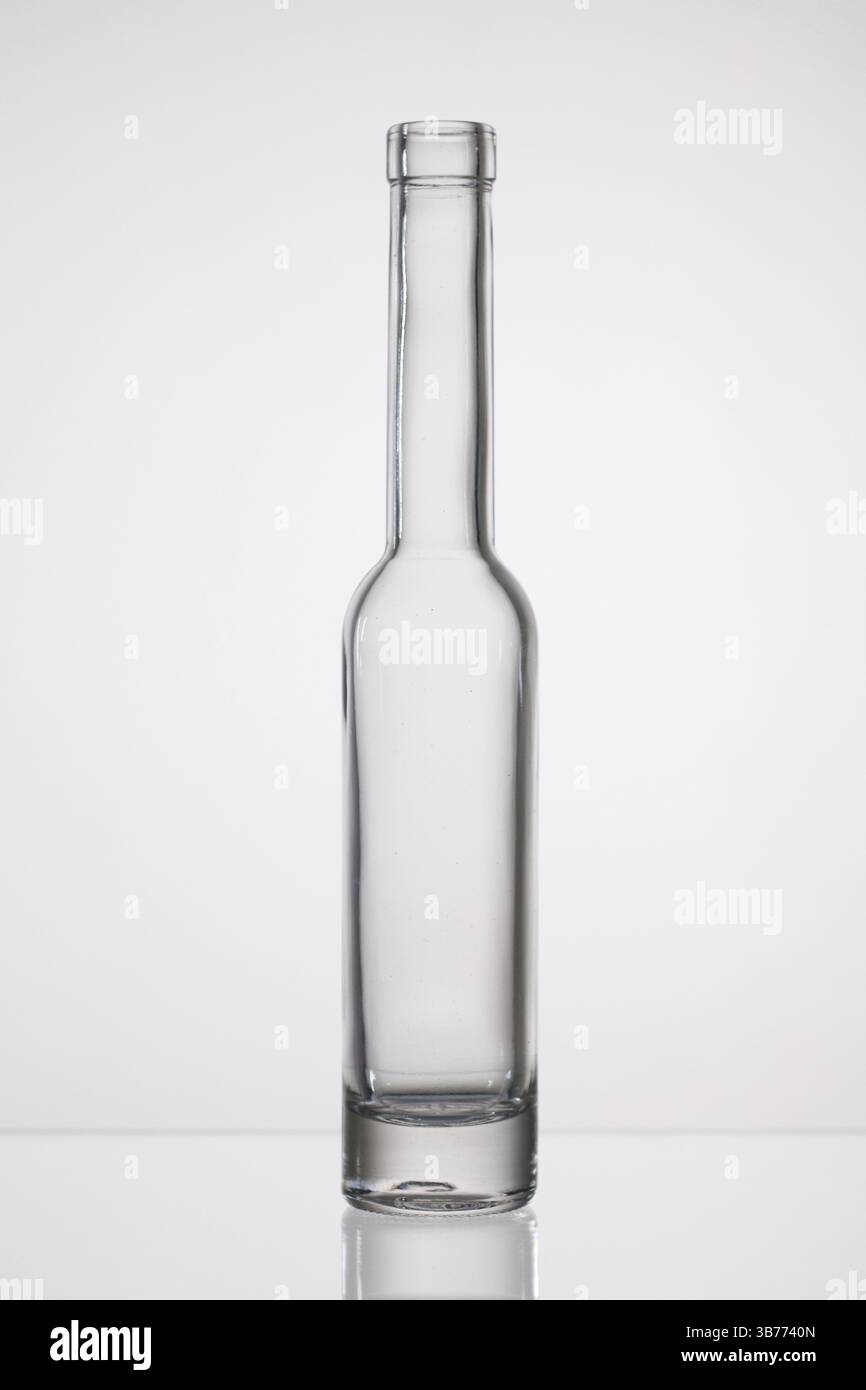 Empty bottle of water on the glass desk Stock Photo - Alamy