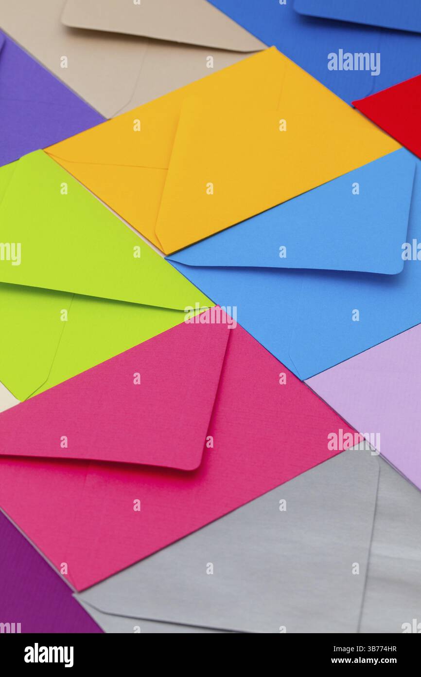 Different colored envelopes on the table Stock Photo - Alamy