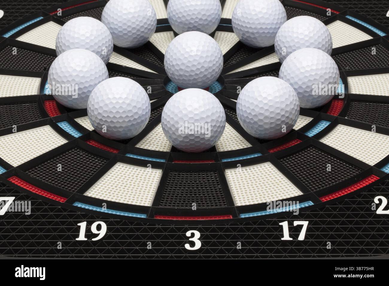 Detail dartboard with white golf balls Stock Photo - Alamy