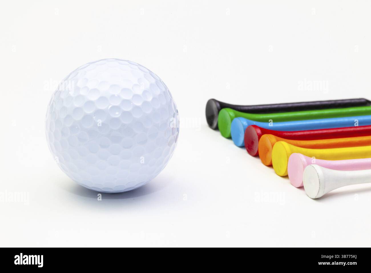 Golf set - ball with tees. Golf tees in the rainbow colors Stock Photo ...