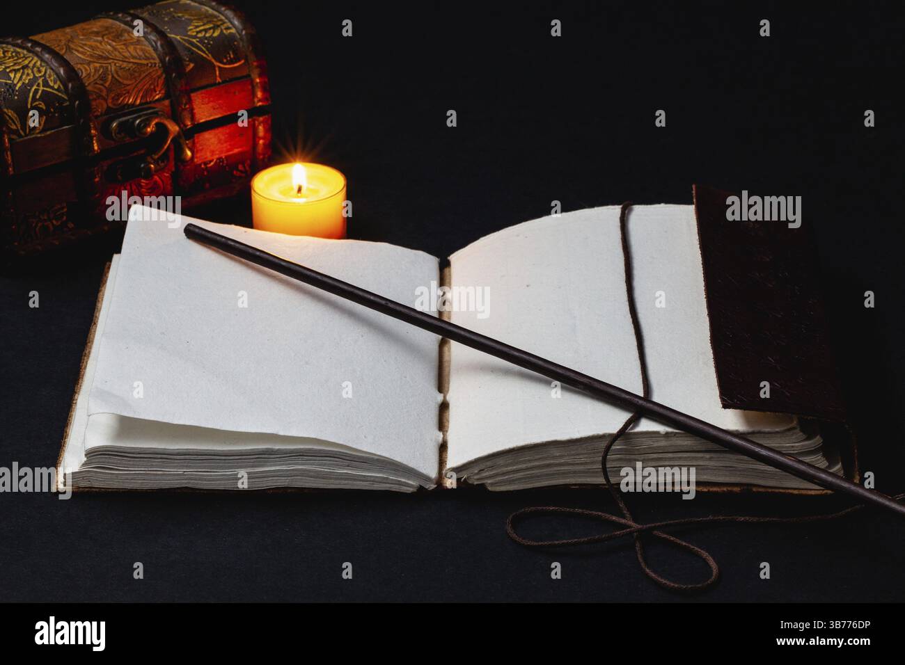 Image of open magic book and wand on the table in the dark room Stock ...