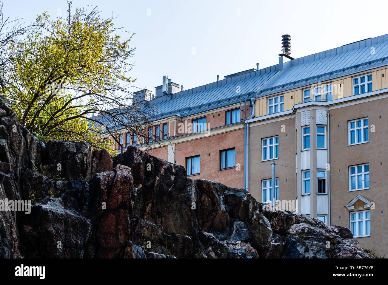 Apartment buildings rise above a rocky outcrop in Helsinki, Finland ...