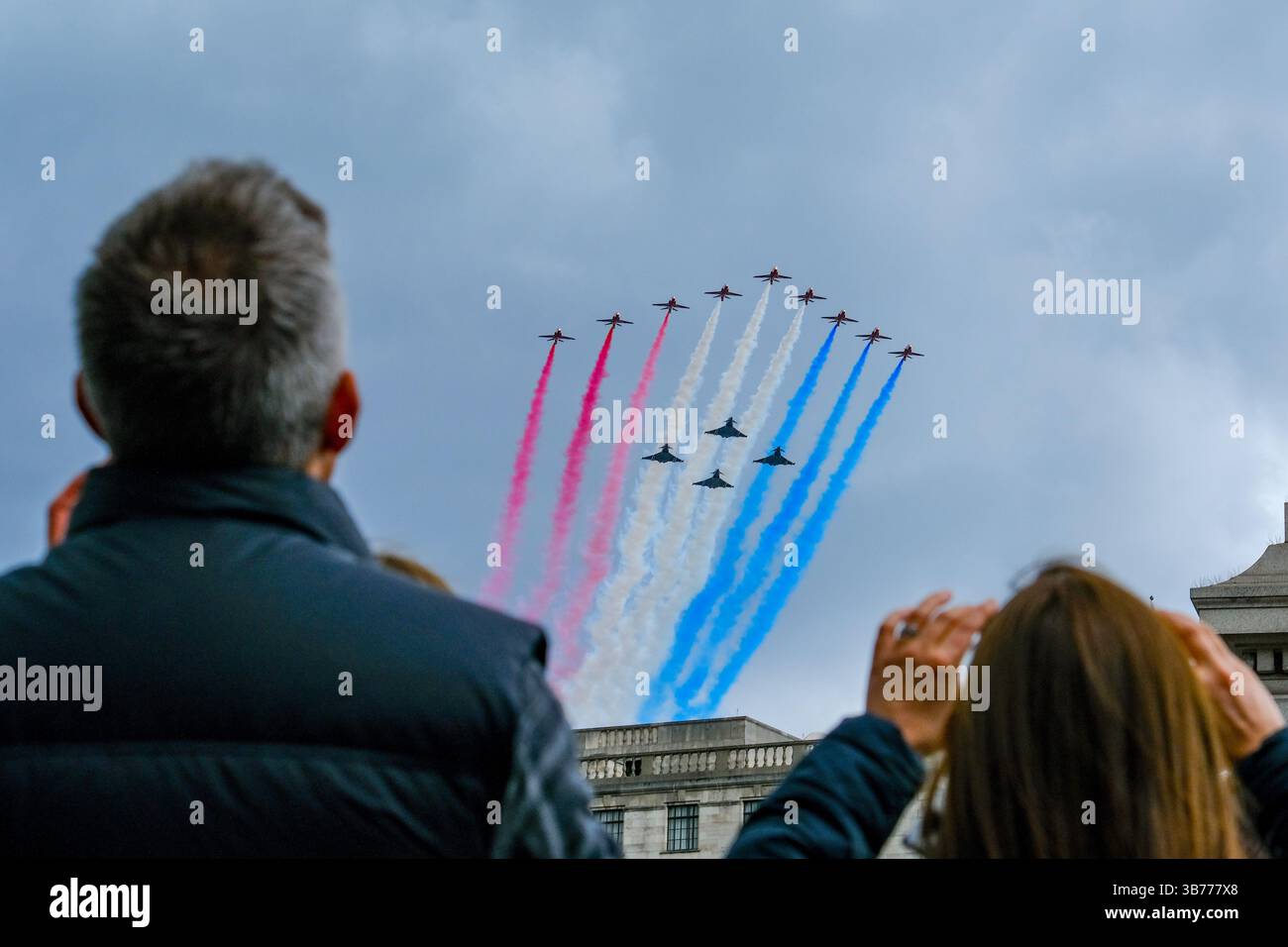 London, UK. 5th May, 2025. Spectators clap and film the Red Arrows ...