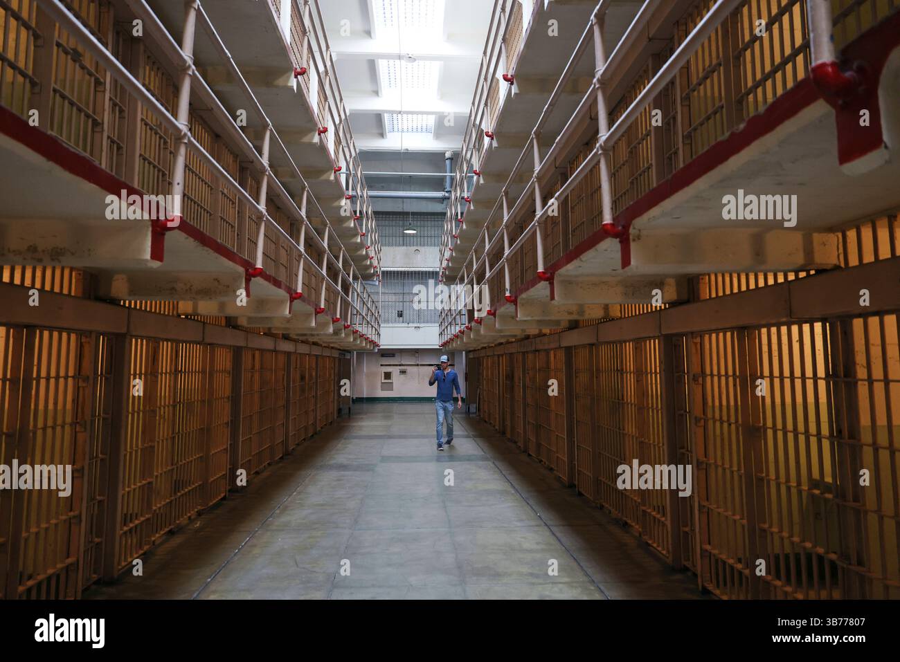 A visitor takes a tour of the prison cells on Alcatraz Island Monday ...