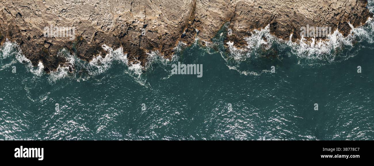 Aerial shot waves hit rocks hi-res stock photography and images - Alamy