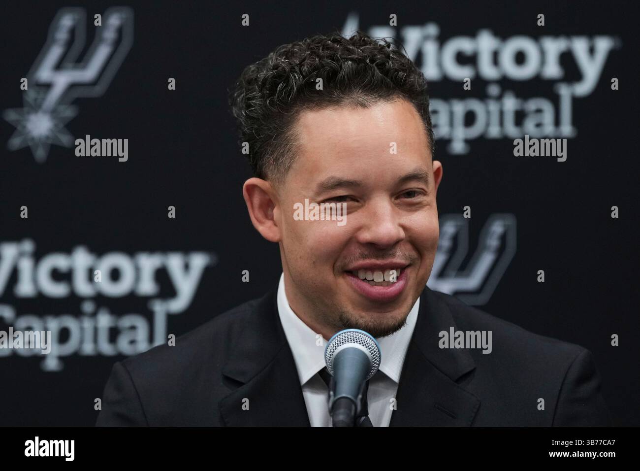 Mitch Johnson answers questions after he was introduced as the new head ...