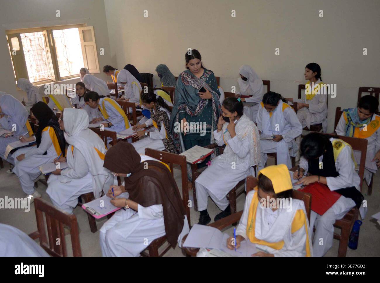Intermediate students solve examination papers during Annual ...