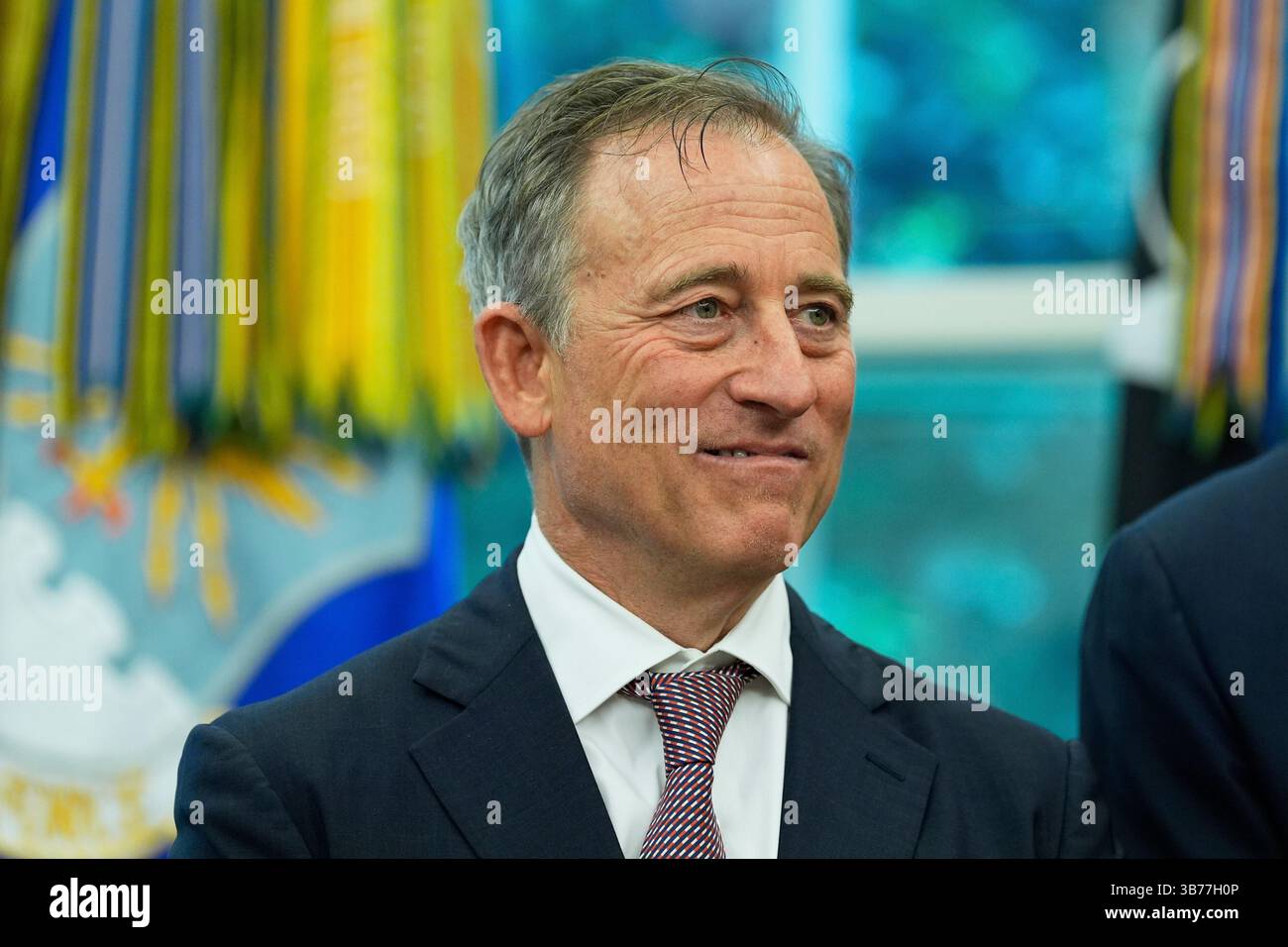 Washington Commanders owner Josh Harris listens as President Donald ...