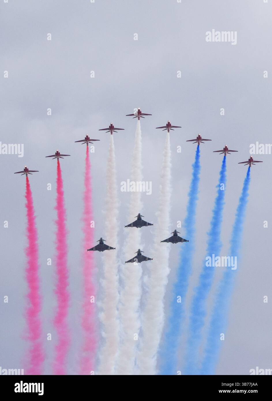 London, UK. 5th May 2025. Red Arrows perform a flypast over The Mall ...