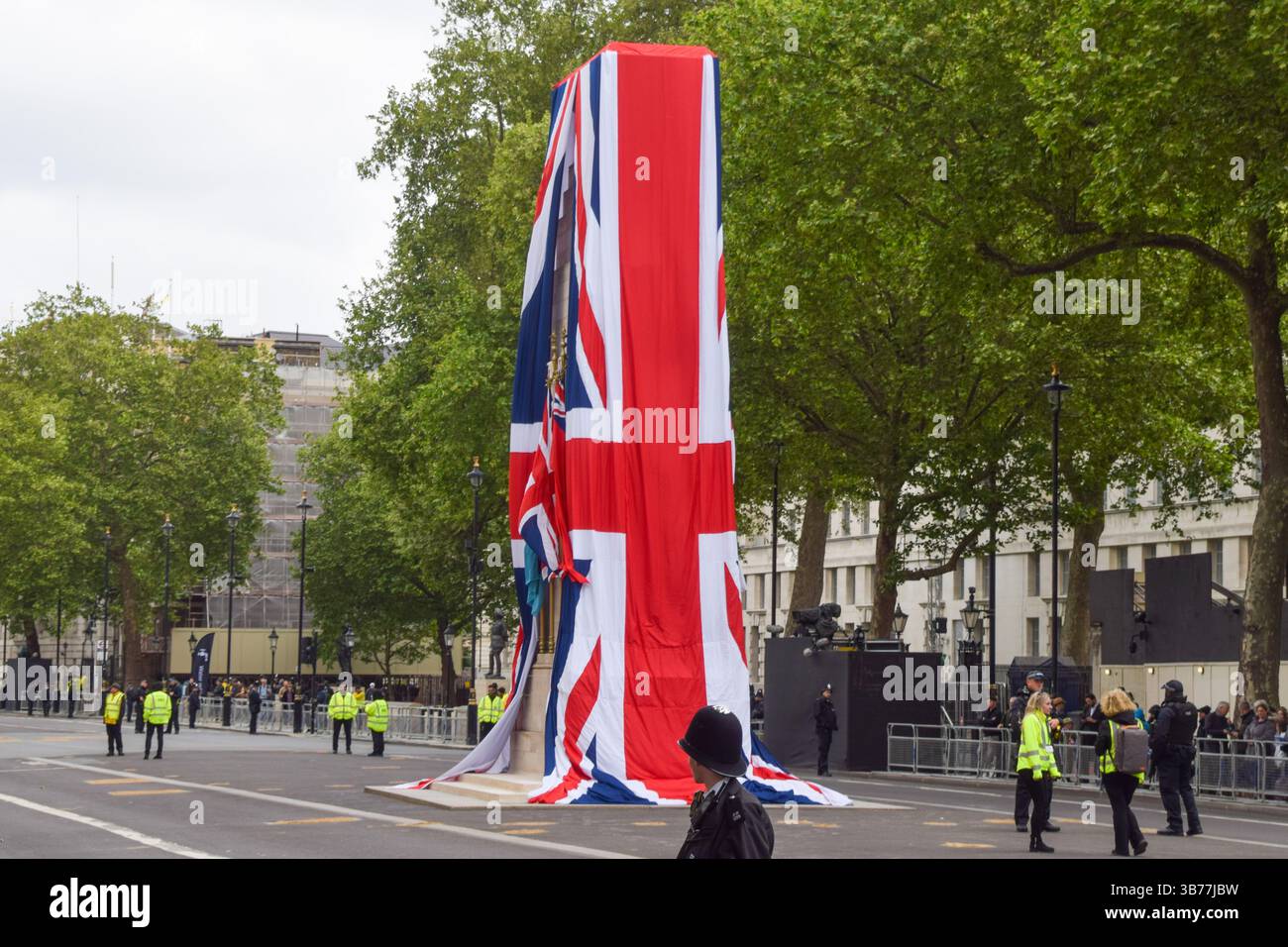 London, UK. 5th May 2025. The Cenotaph war memorial is draped in giant ...