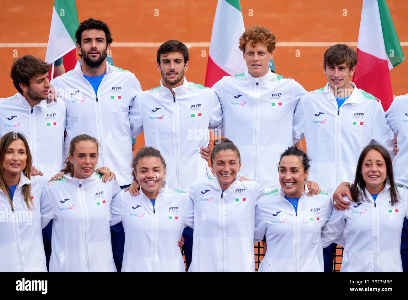 Italian tennis players and staff members celebrate the victory of the ...