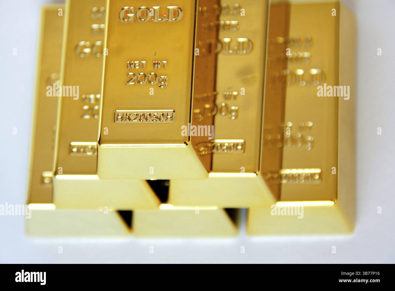 Gold bars stacked Stock Photo - Alamy